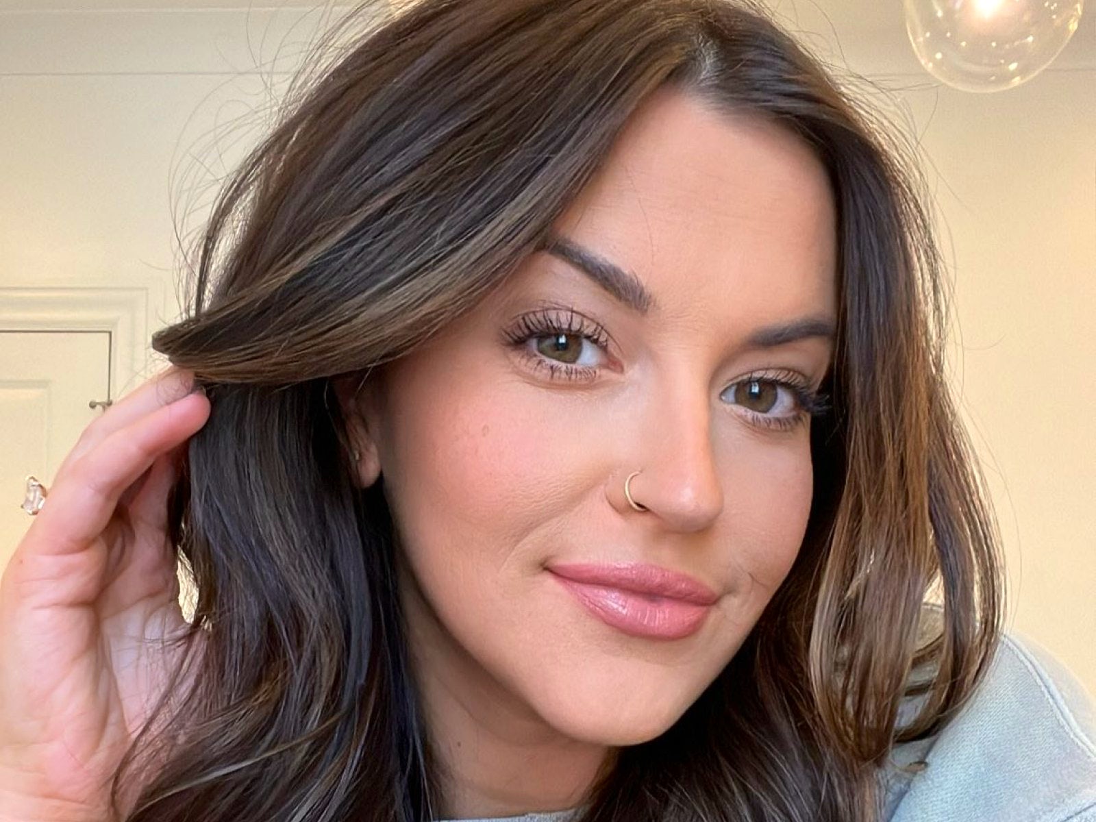 'The Bachelor' alum Tia Booth fires back at trolls, defends hiring help ...